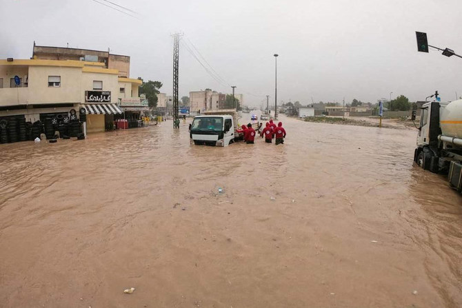 Libyan city buries thousands in mass graves after flood, while mayor says death toll could ...